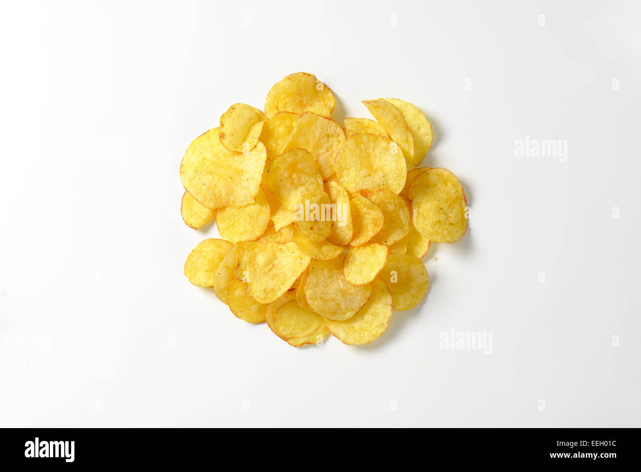 Heap of potato chips on white background Stock Photo - Alamy