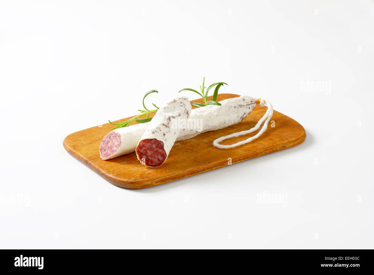 Spanish salami fuet on a cutting board Stock Photo - Alamy