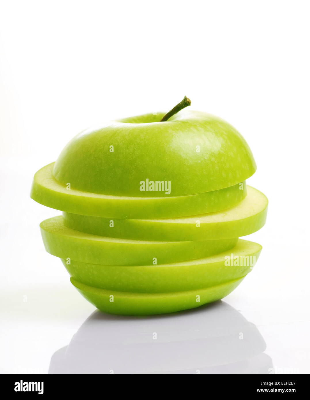 sliced green apple isolated on white Stock Photo - Alamy