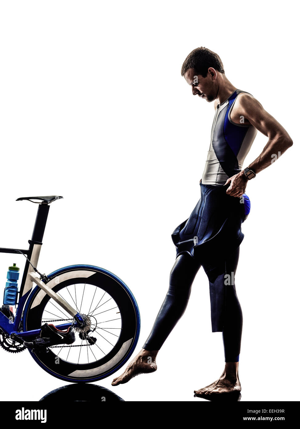 man triathlon iron man athlete standing with all his equipment in ...
