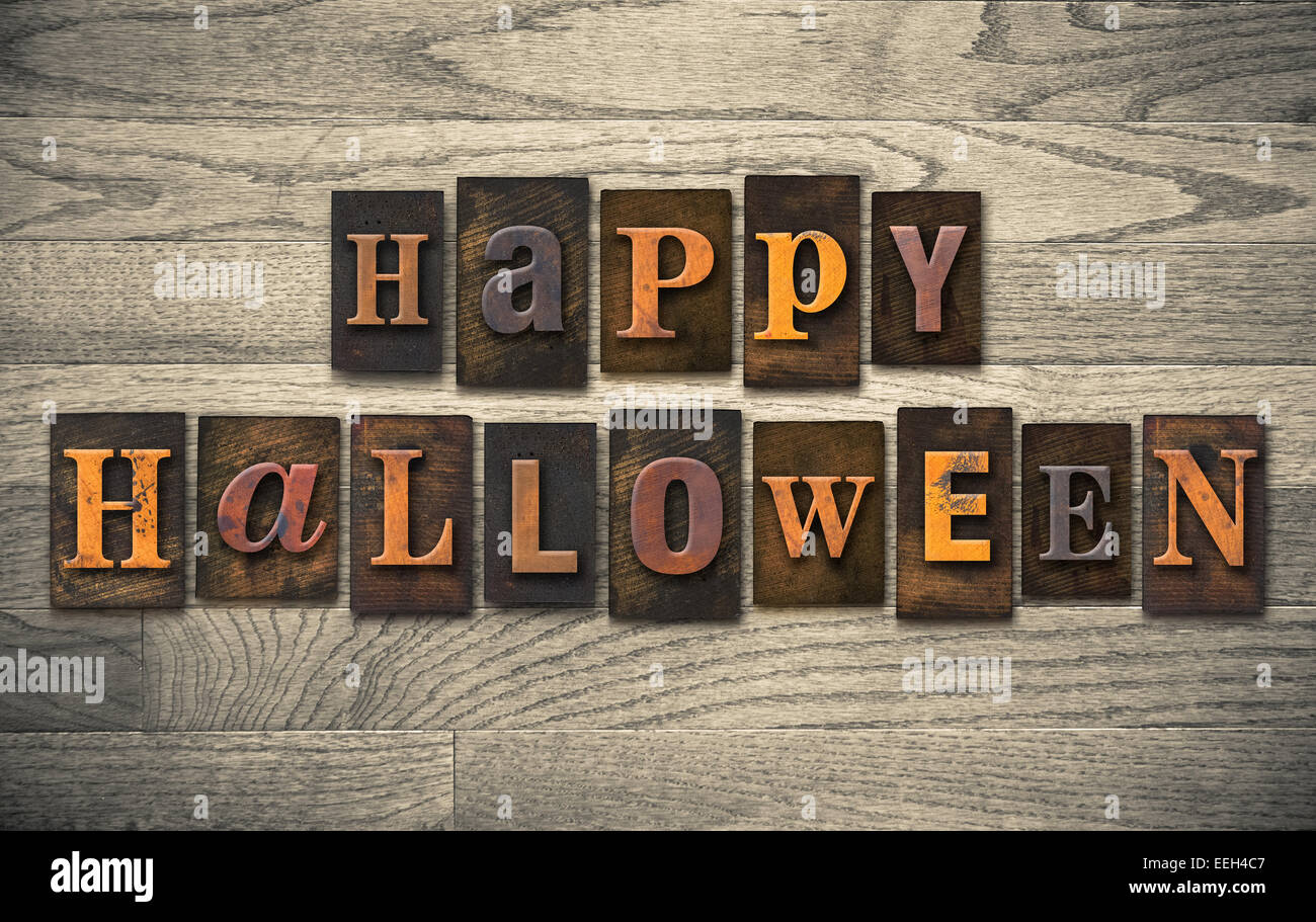 The words "HAPPY HALLOWEEN" written in vintage wooden letterpress type ...