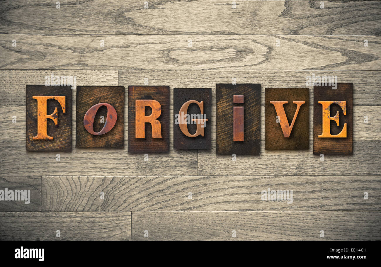 The word "FORGIVE" written in vintage wooden letterpress type Stock ...