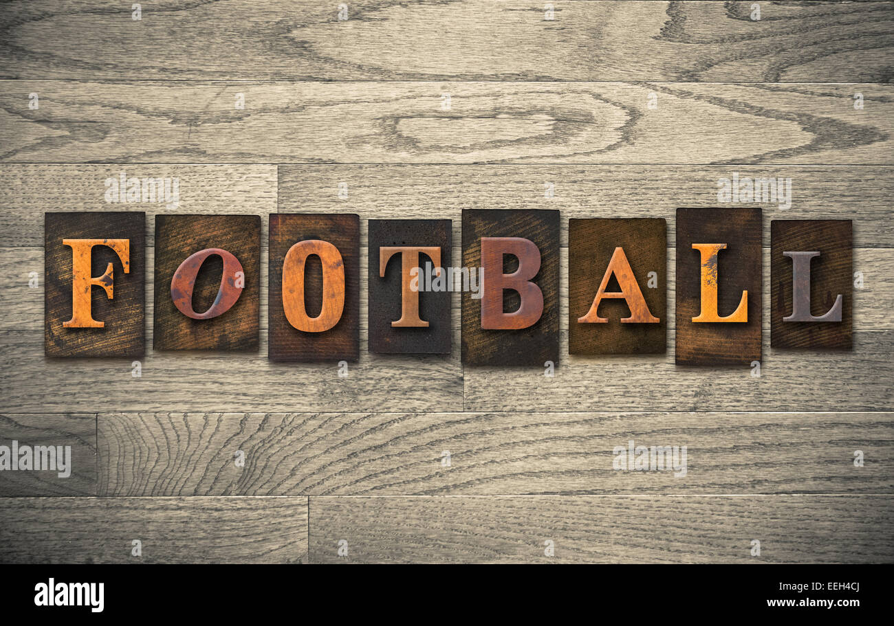 The word "FOOTBALL" written in vintage wooden letterpress type Stock ...