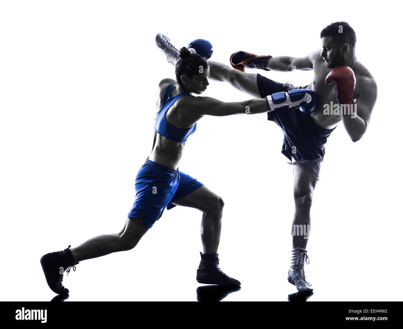 one woman boxer boxing one man kickboxing in silhouette isolated on ...