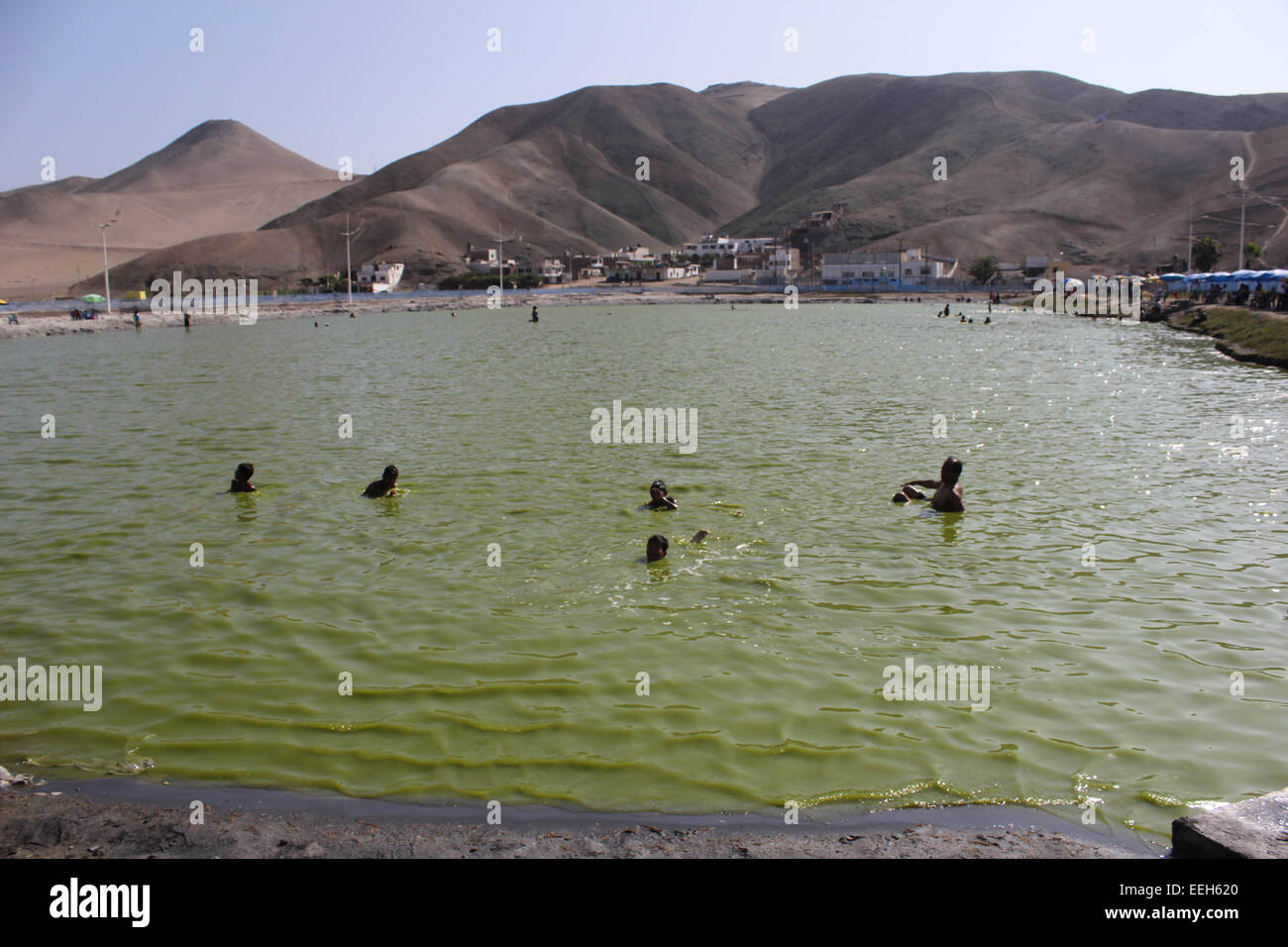 Chilca, Peru. 18th Jan, 2015. Visitors bathe in the waters of the ...
