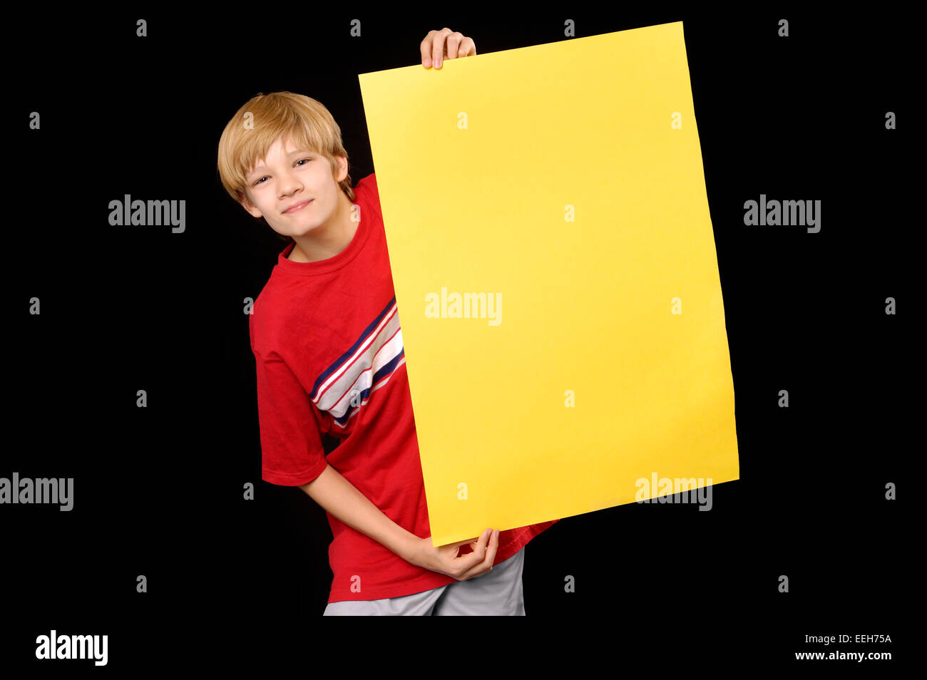 Twelve year old boy holding a blank sign. Add your own message to the ...