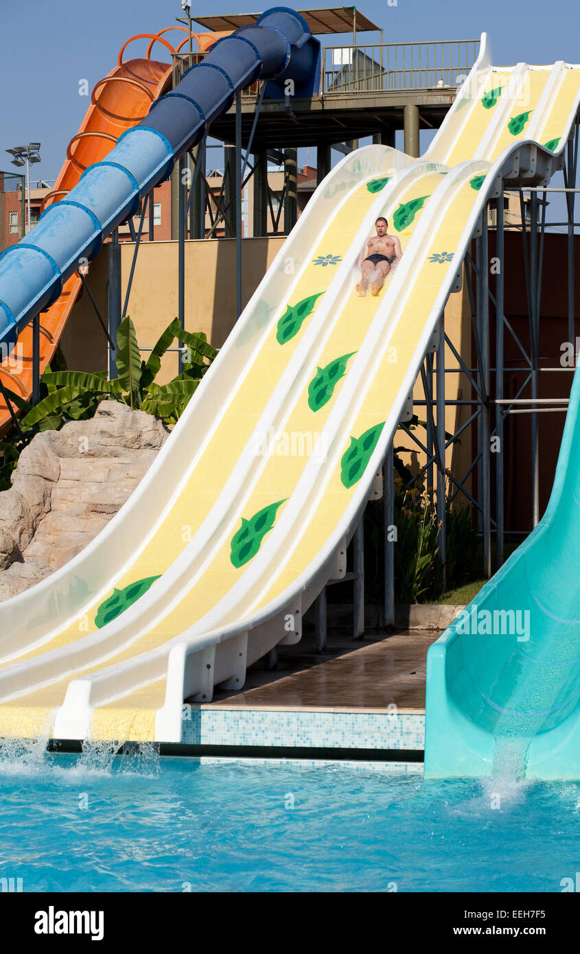 Man riding a water slide Stock Photo - Alamy