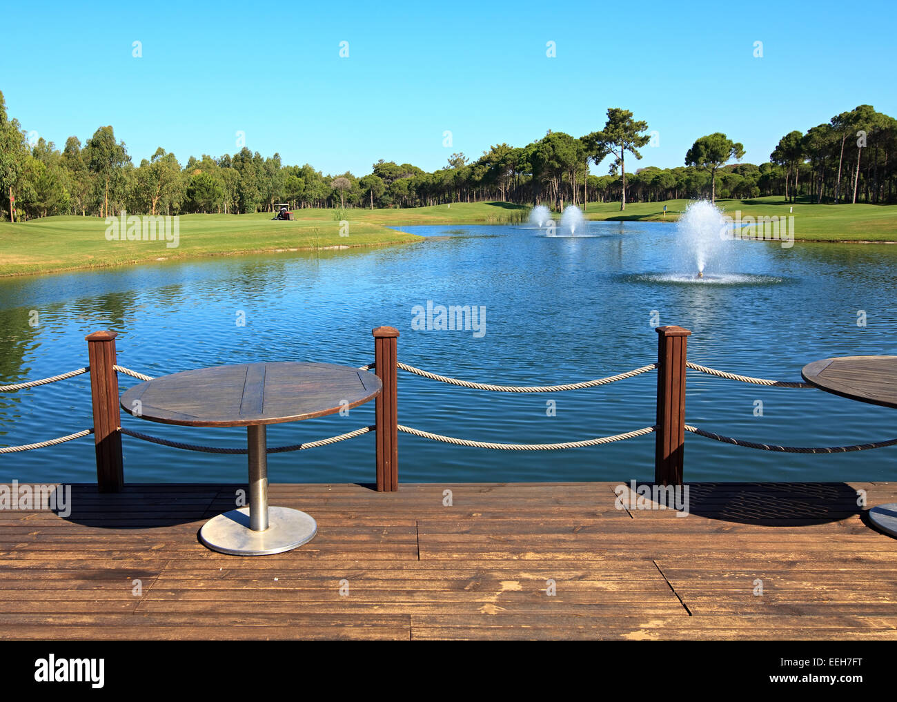 Cafe on the artificial pond with fountain Stock Photo - Alamy