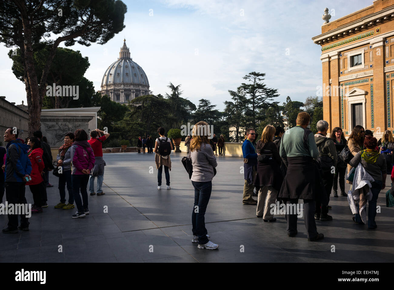 Rome, visitors in the Vatican Museums terrace with the St Peter Dome in ...