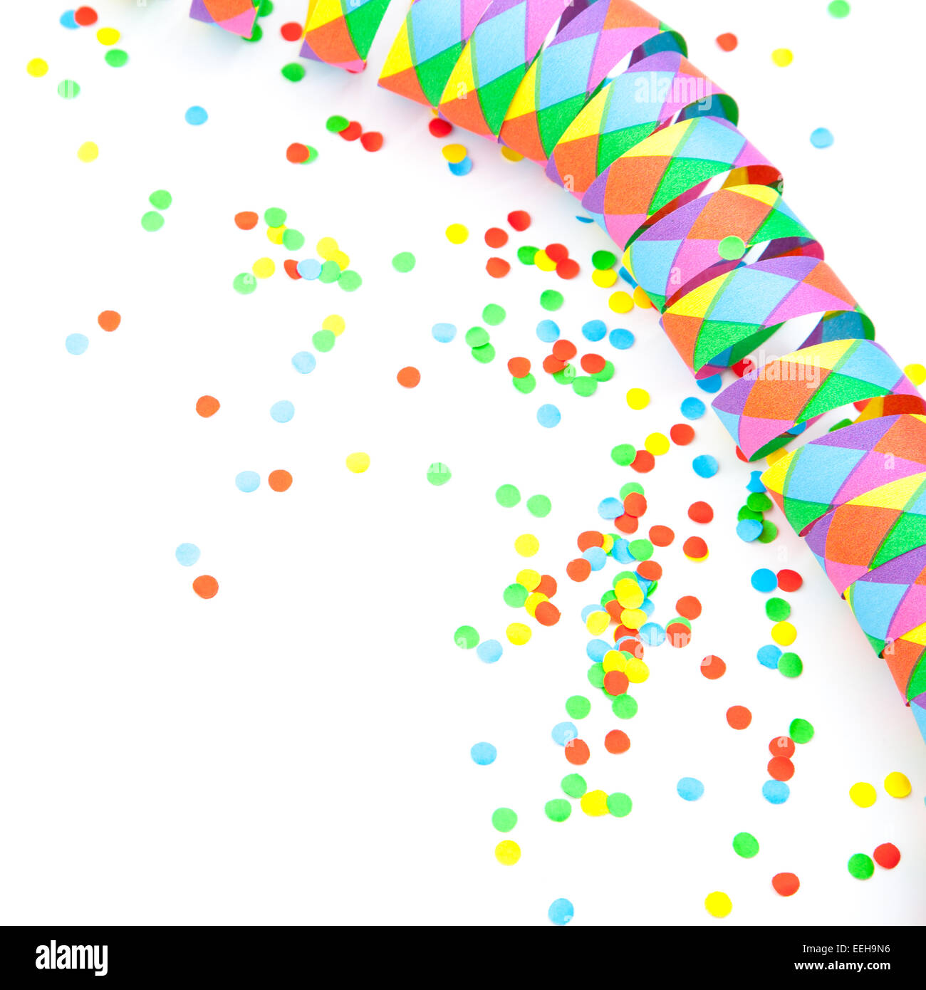 Party streamer and confetti on white background Stock Photo - Alamy