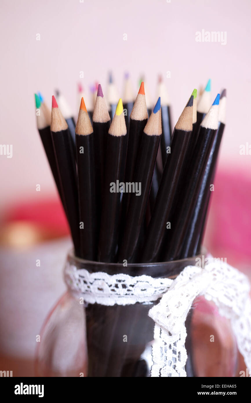 Stack of colored pencils in a glass Stock Photo - Alamy