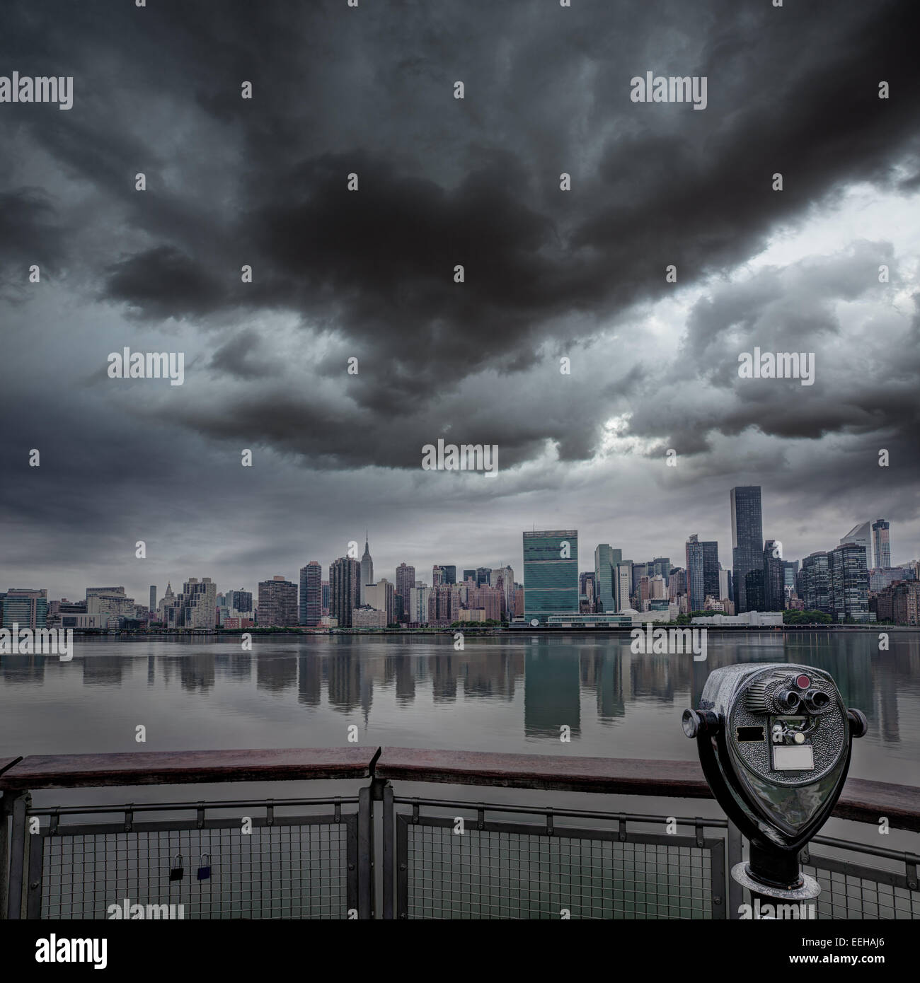 Manhattan New York cloudy dramatic skyline sunset from East River dusk ...