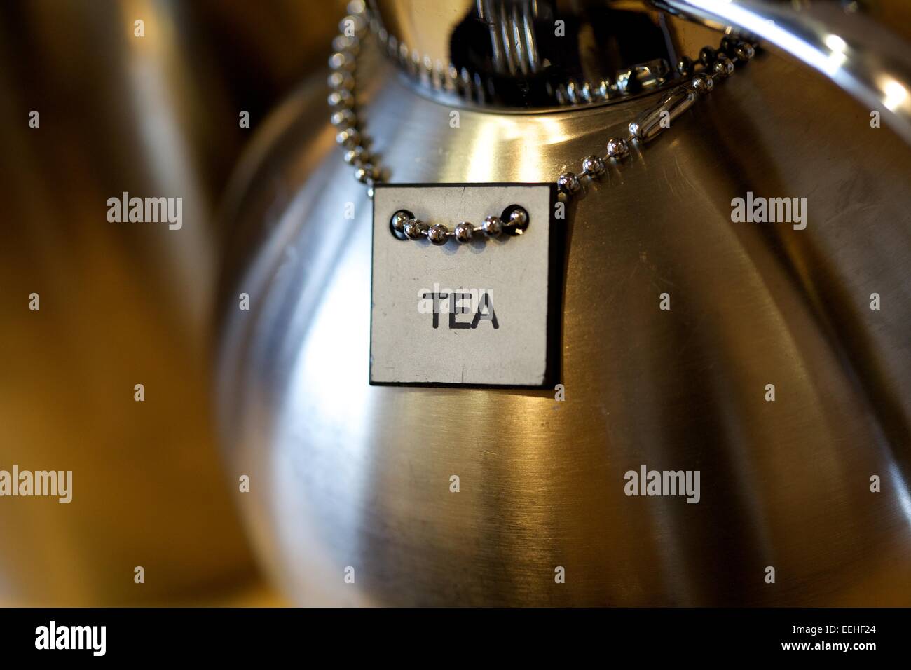 tea sign on silver tea holder Stock Photo - Alamy