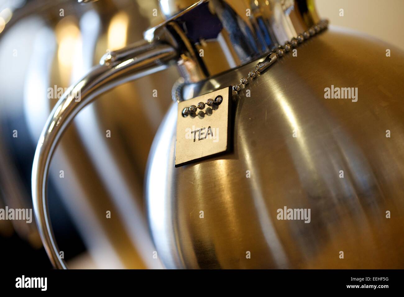 tea sign on silver tea holder Stock Photo - Alamy