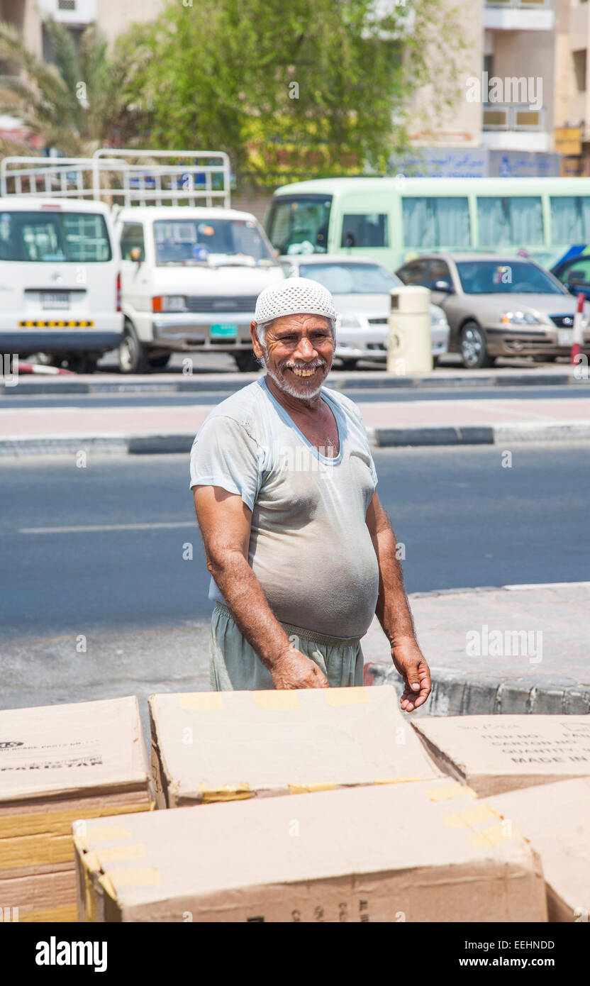 Typical manual dock worker: Smiling happy local paunchy dock labourer ...