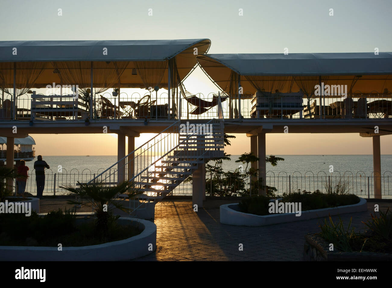 Sunset view of the seaside restaurant in the resort town of Alushta ...