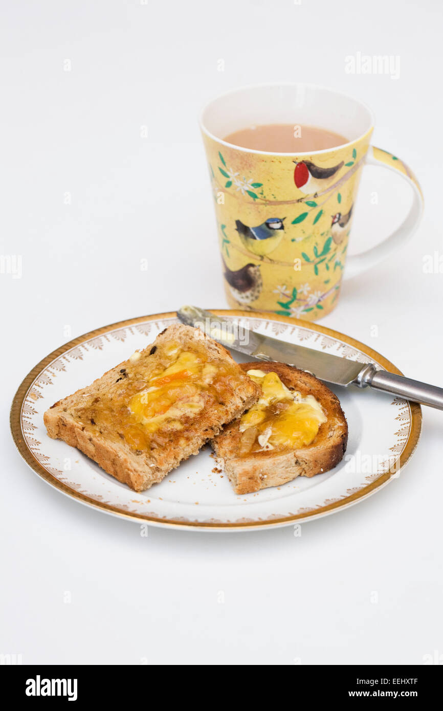 Tea and toast on a white background Stock Photo - Alamy