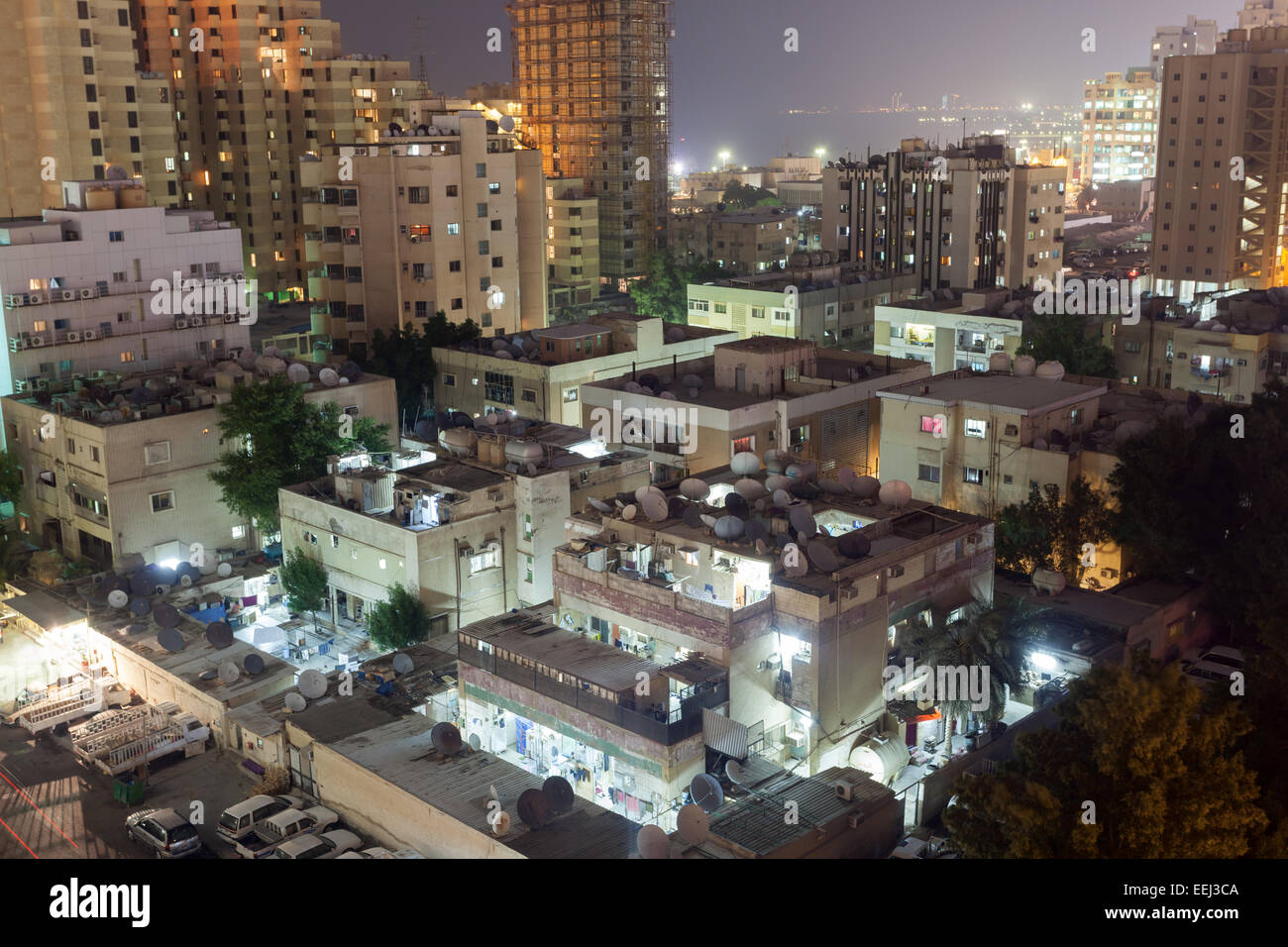 Residential buildings in Kuwait City at night Stock Photo - Alamy