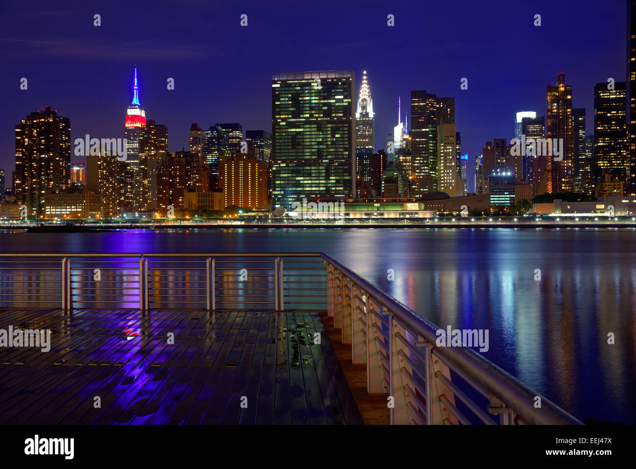 Manhattan New York skyline at sunset rainy dusk from East River NYC USA ...