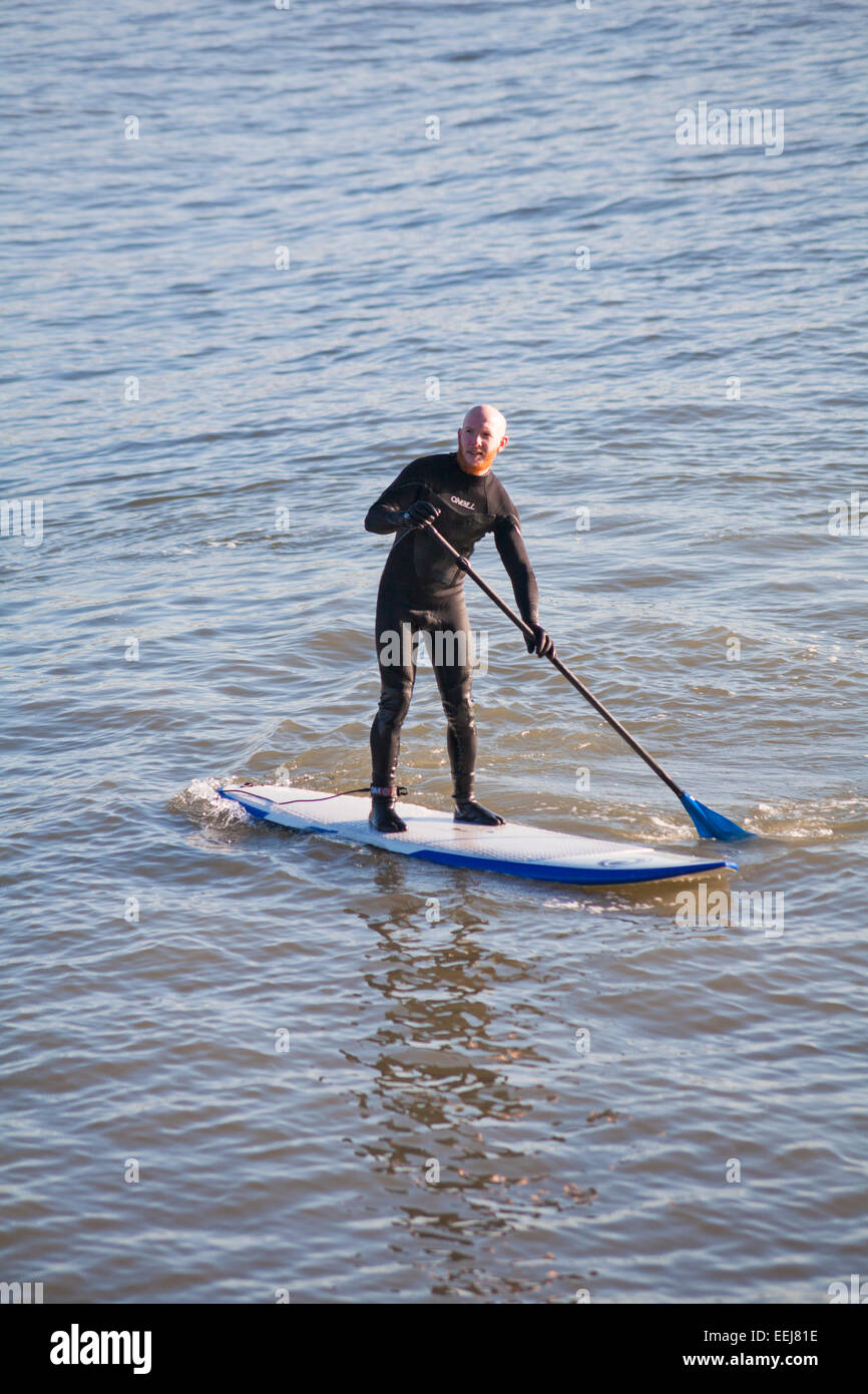 Male paddleboarding in sea hi-res stock photography and images - Alamy