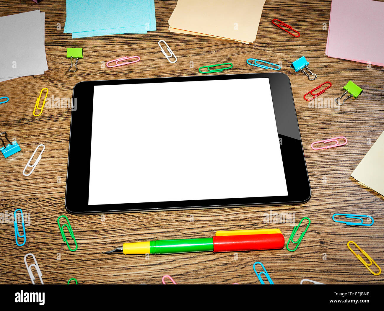 Tablet PC on the office table surrounded by multi-colored clips Stock ...