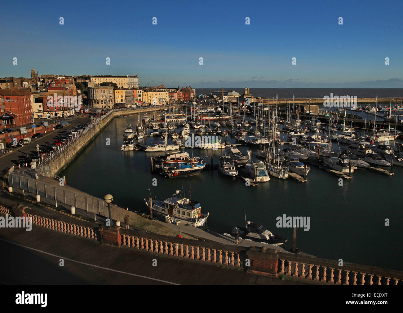 Boats and colourful buildings at the harbour at West Cliff, Ramsgate ...