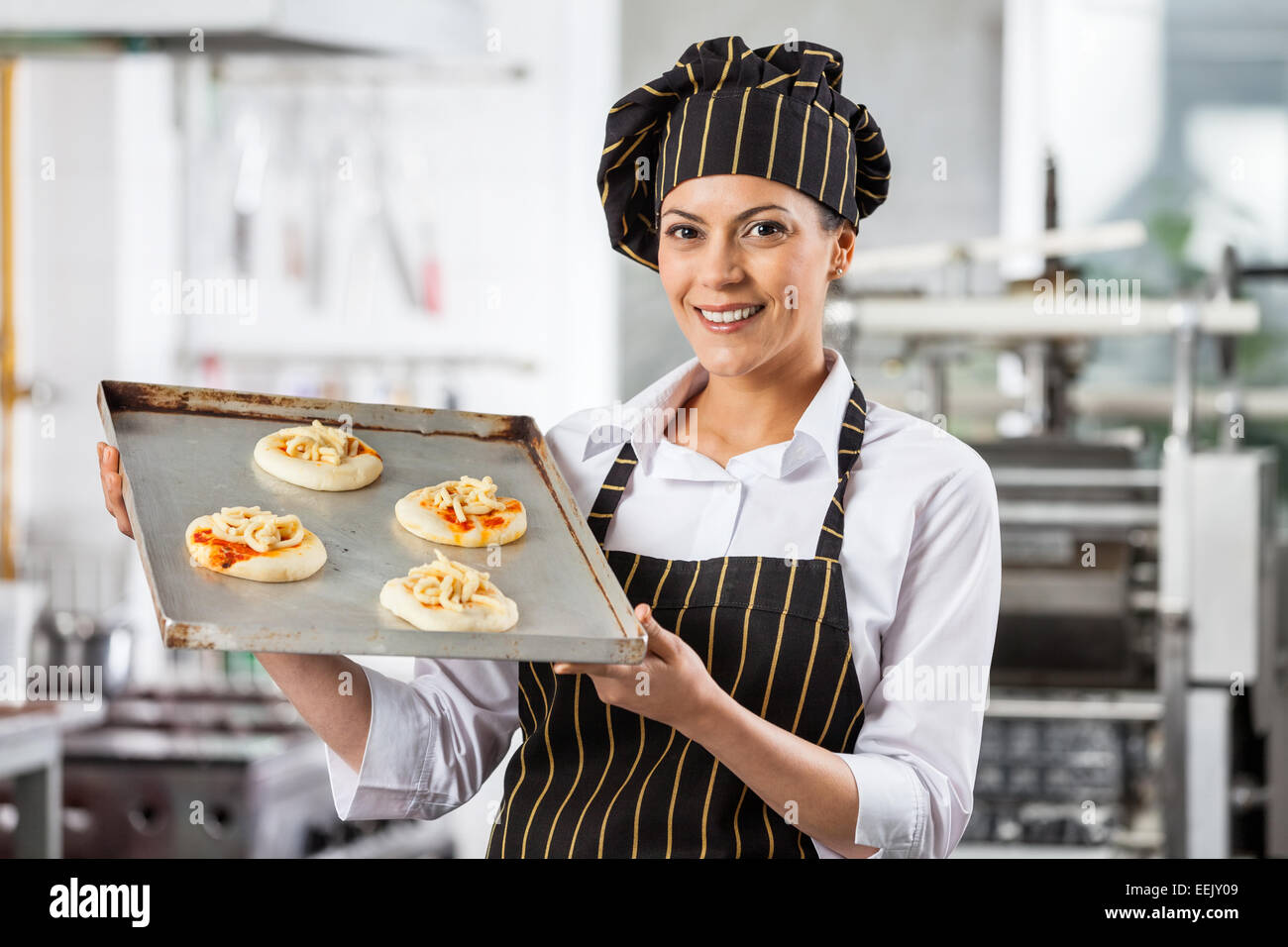 Portrait female pizza chef hi-res stock photography and images - Alamy