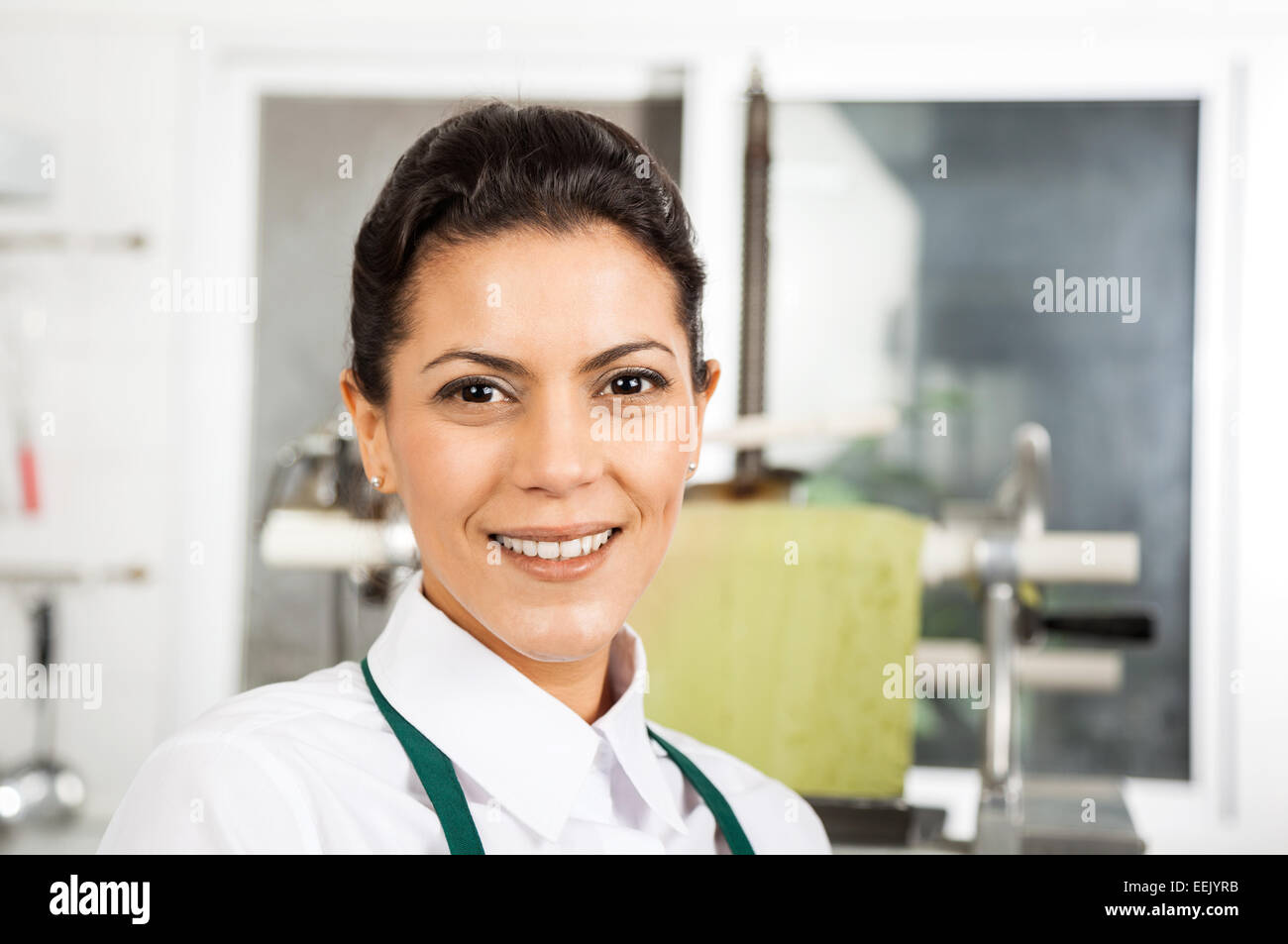 Happy Female Chef At Kitchen Stock Photo - Alamy