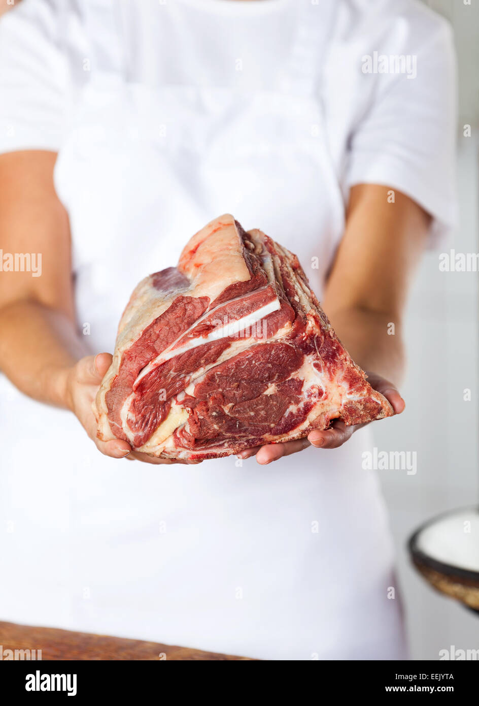 Midsection Of Butcher Holding Meat Stock Photo - Alamy