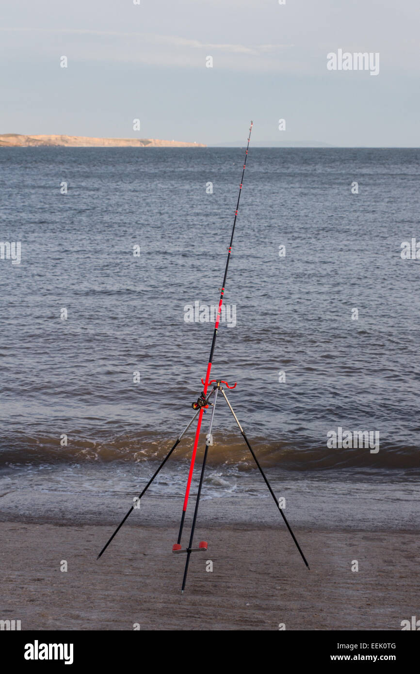 A fishing rod on a stand on the beach at Porthcawl, South Wales Stock ...