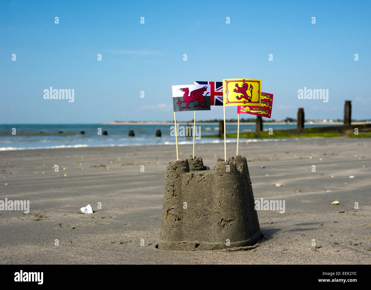 A sandcastle with flags on West Wittering beach West Sussex Stock Photo ...
