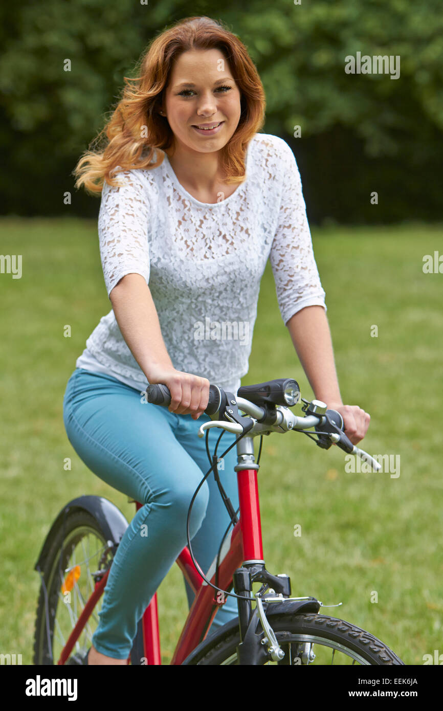 Portrait Of Teenager Girl Riding Bike In Countryside Stock Photo - Alamy