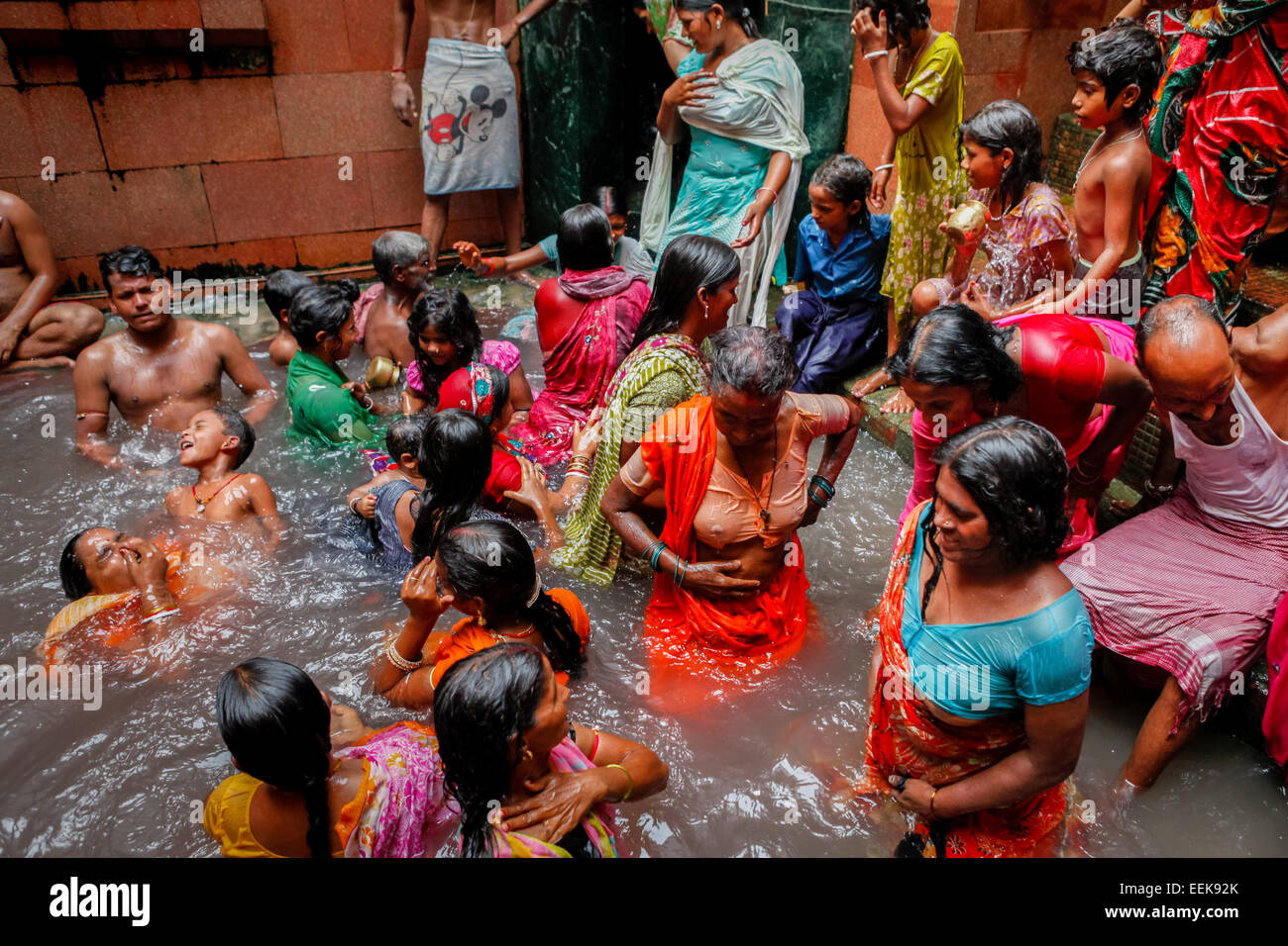 People taking a bath at a hot spring, which is believed to have ...