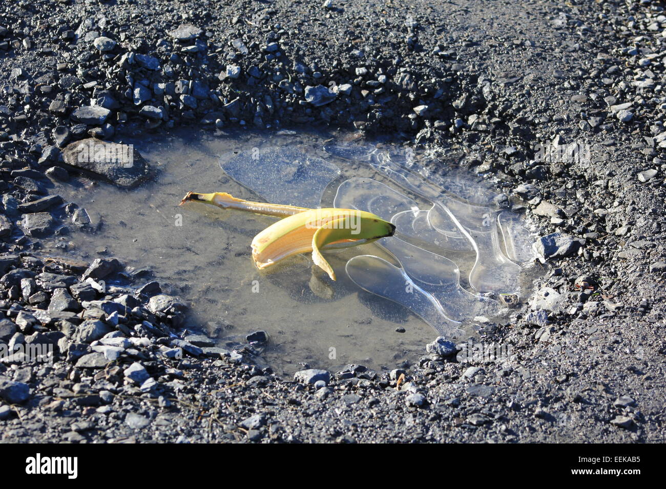 A banana skin lies in wait on a frozen pothole for an unsuspecting ...