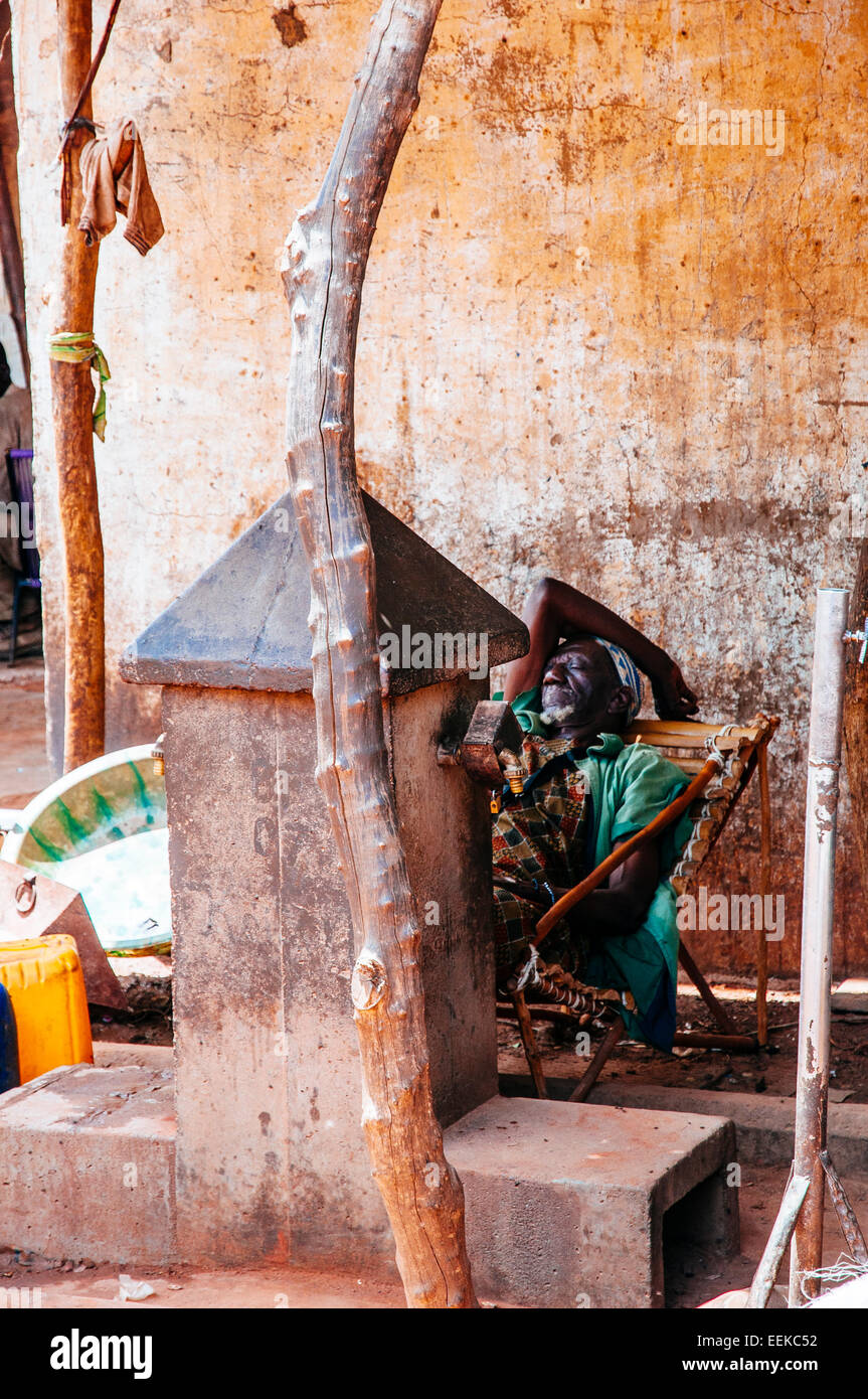 Man chilling at a chair on the streets, Mali Stock Photo - Alamy