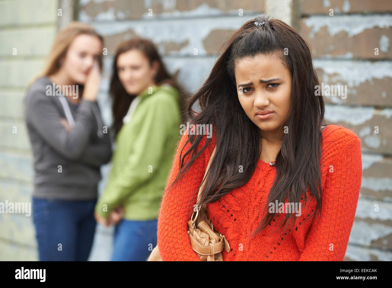 Unhappy Teenage Girl Being Gossiped About By Peers Stock Photo - Alamy