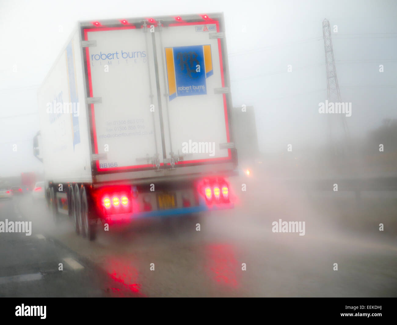 Motorway spray difficult driving conditions Stock Photo - Alamy