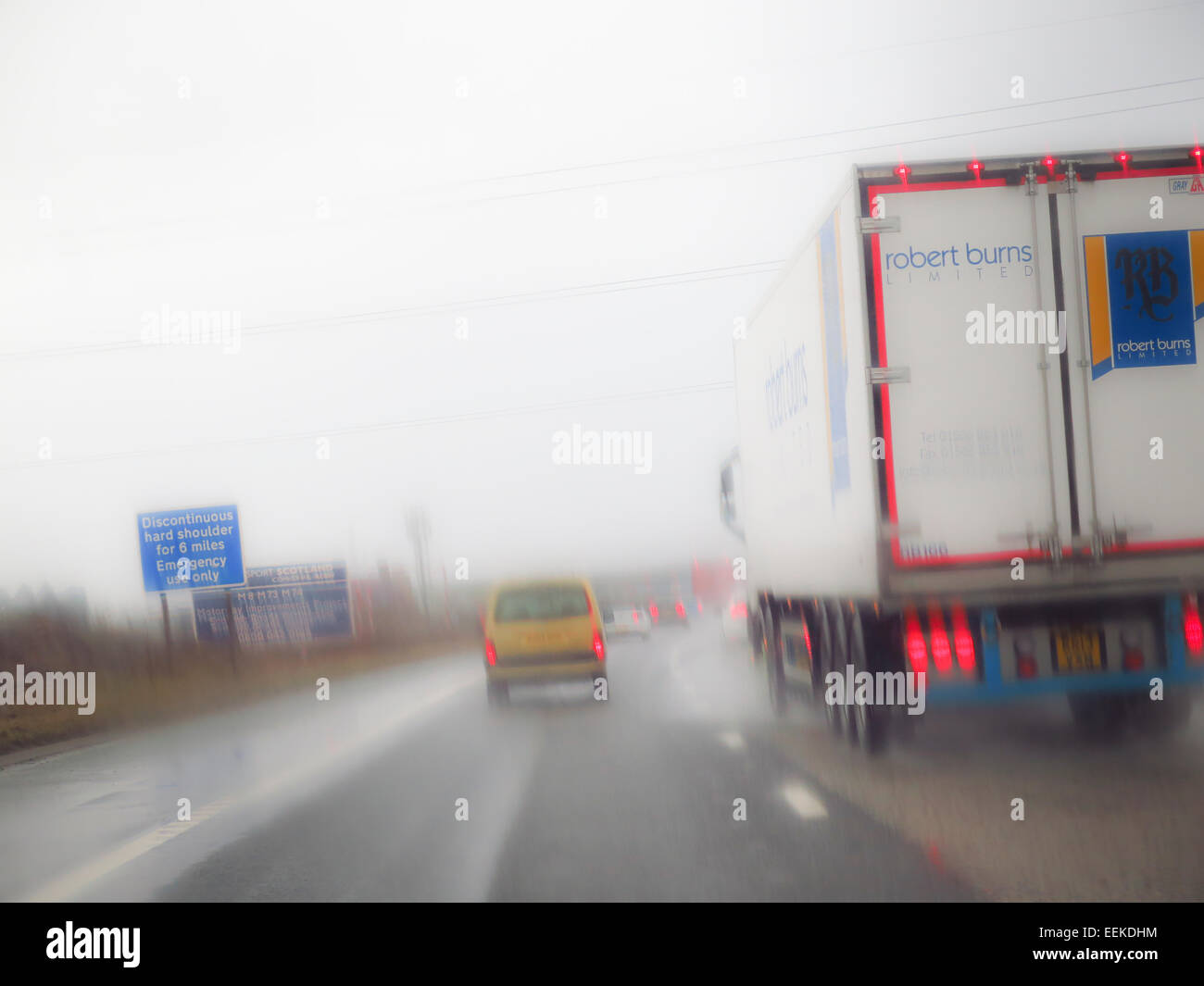 Motorway spray difficult driving conditions Stock Photo - Alamy
