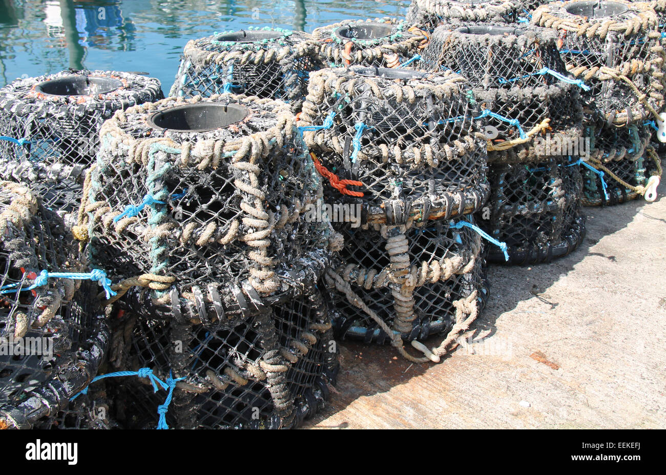 A Stack of Fishing Pots on a Harbour Wall Stock Photo - Alamy