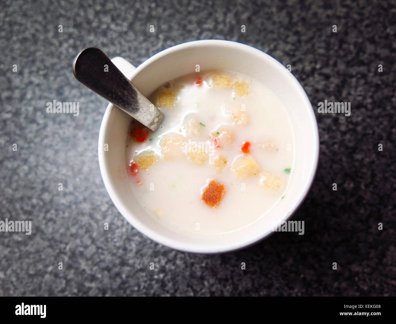 Cup a soup in mug with spoon Stock Photo - Alamy