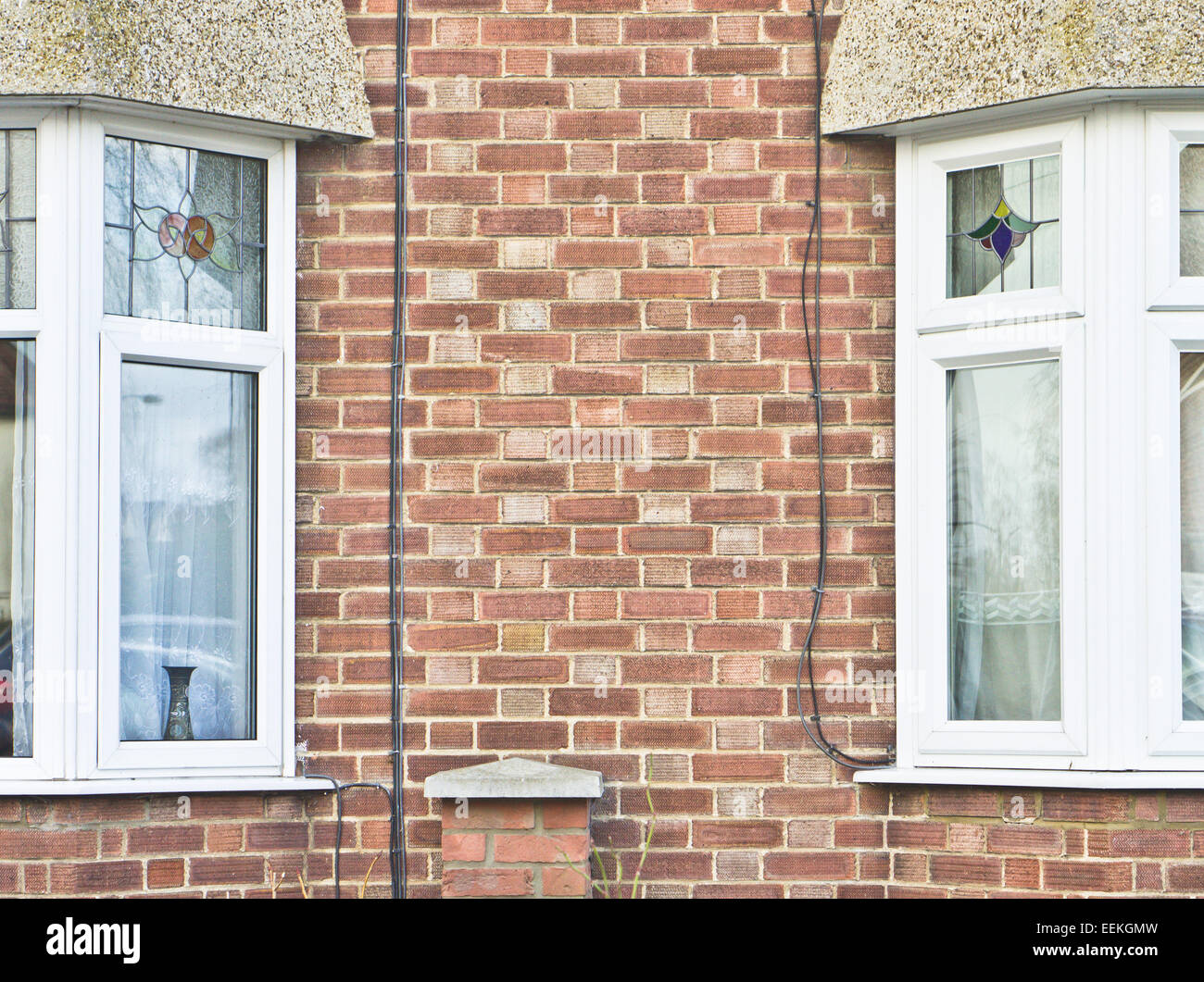 Double glazed bay windows in adjoining houses Stock Photo - Alamy