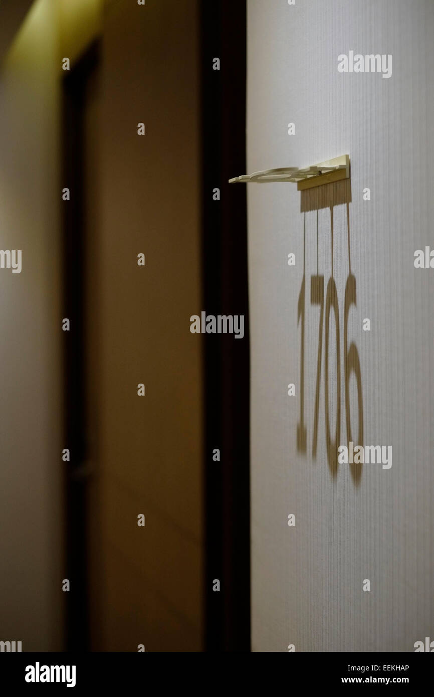 A room number cast a shadow on a wall in the luxurious Sofitel So hotel ...