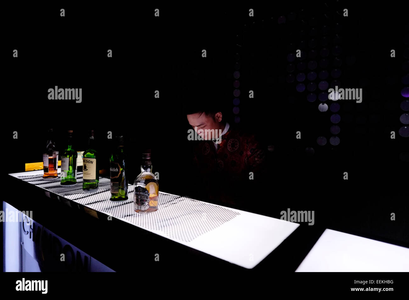 A barman at Belga rooftop bar in the luxurious Sofitel So hotel in the ...