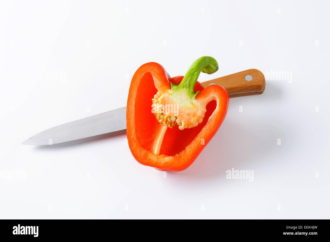 Half a red bell pepper and kitchen knife Stock Photo - Alamy