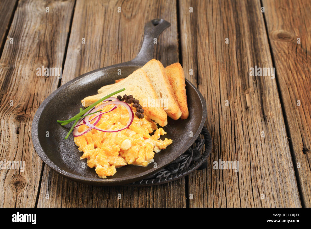 Breakfast - Scrambled eggs and toasted bread Stock Photo - Alamy