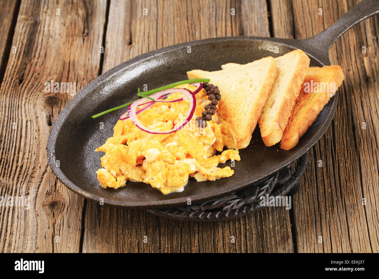 Breakfast - Scrambled eggs and toasted bread Stock Photo - Alamy