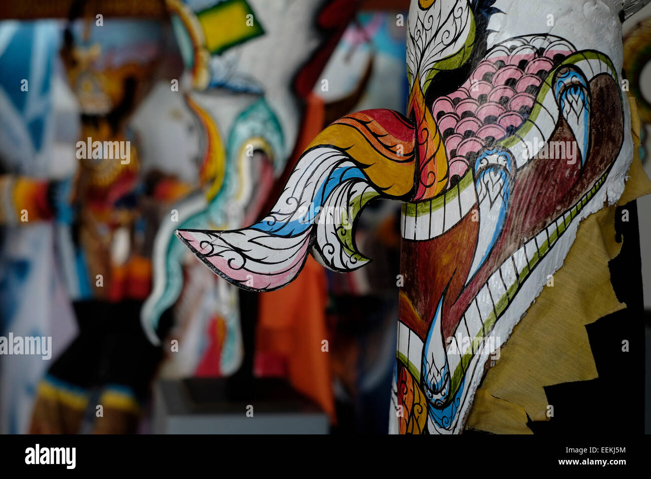 A traditional Phi Ta Khon mask made from carved coconut tree trunk ...