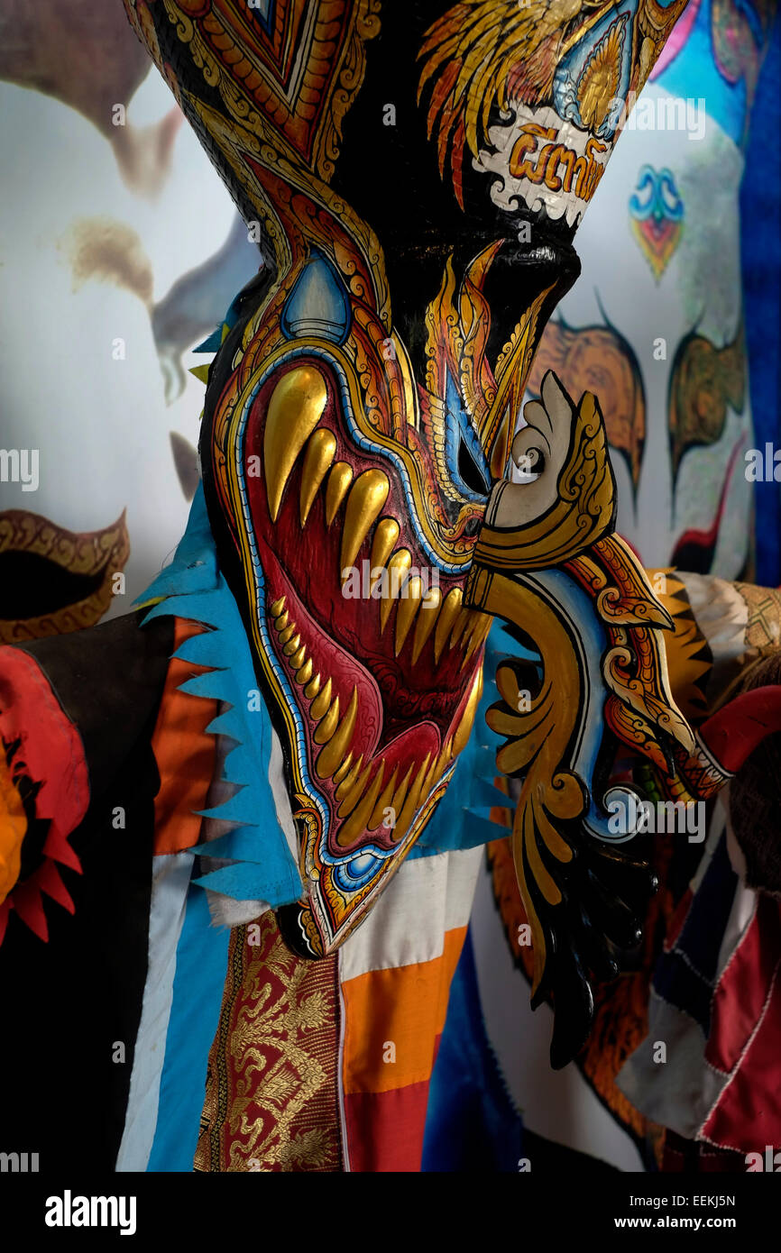 A traditional Phi Ta Khon mask made from carved coconut tree trunk ...