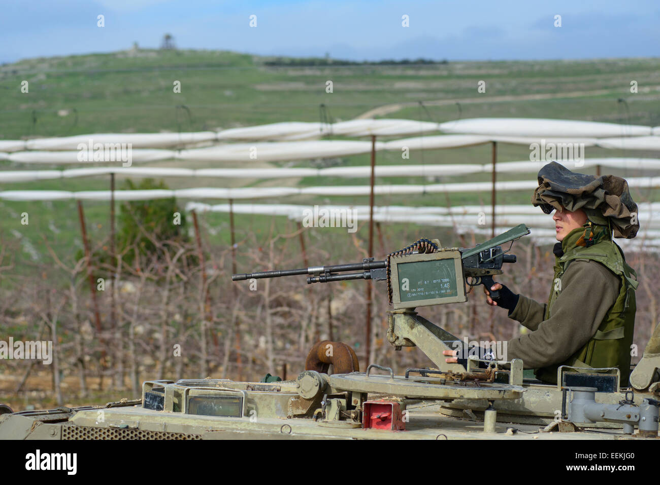 Golan Heights. 19th Jan, 2015. An Israeli soldier looks on atop of an ...