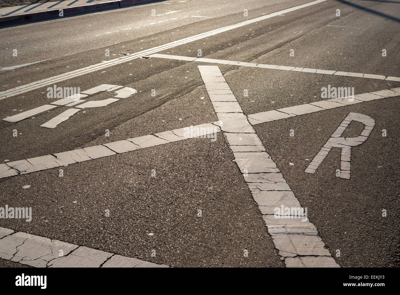 Railroad crossing warning sign painted on an asphalt road Stock Photo ...